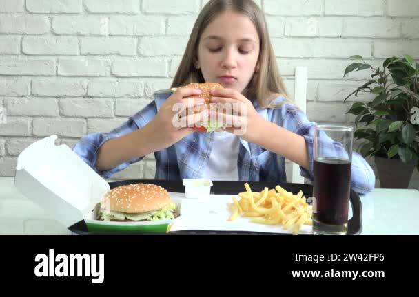 Kid Eating Fast Food, Child Eats Hamburger in Restaurant, Teenager Girl ...