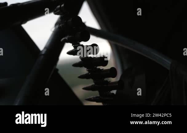 Air machine gun with a trembling cartridge tape and bullets installed ...