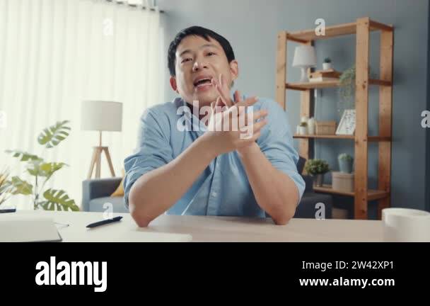 Young Asia businessman using computer laptop talk to colleagues about ...
