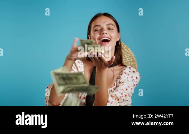 Pretty woman with surprised happy face scatters, waste money. Girl ...