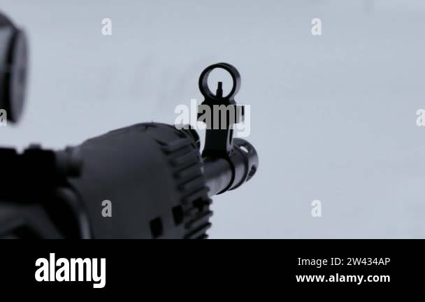 A sniper shoots a Tiger carbine in winter. Shooting at a target through ...