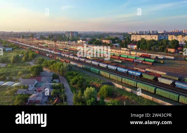 A birds-eye view of a large railway station with lots of carriages ...