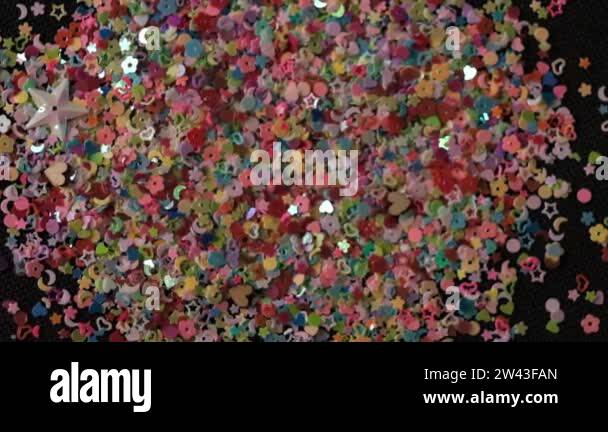 Close up Confetti explosion on black background. Slow Motion confetti ...