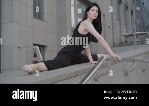 Side view portrait of charming young confident woman bending forward as ...