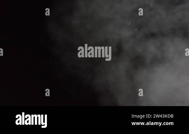 White water vapour on a black background. Close-up shot 4k. Realistic ...