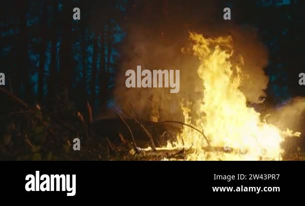 firefighter hero in action danger jumping over fire flame to rescue and ...