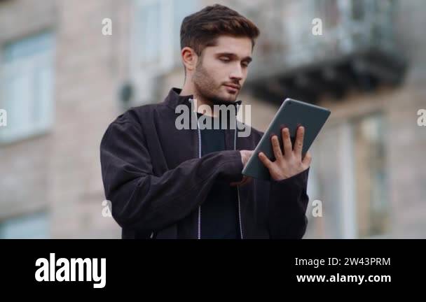 Handsome guy looking tablet screen Stock Videos & Footage - HD and 4K ...