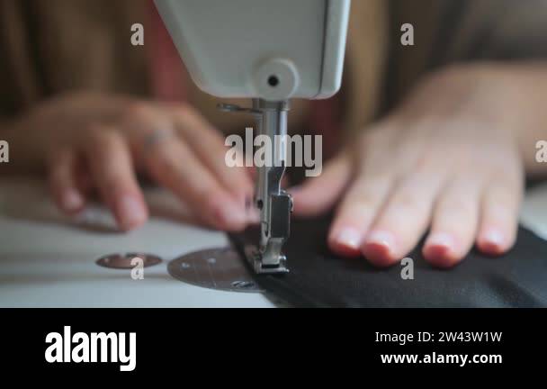 Sewing Machine Needle in Motion. Close-up of sewing machine needle ...