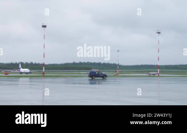 Security car with flashing lights is driving in the background ...