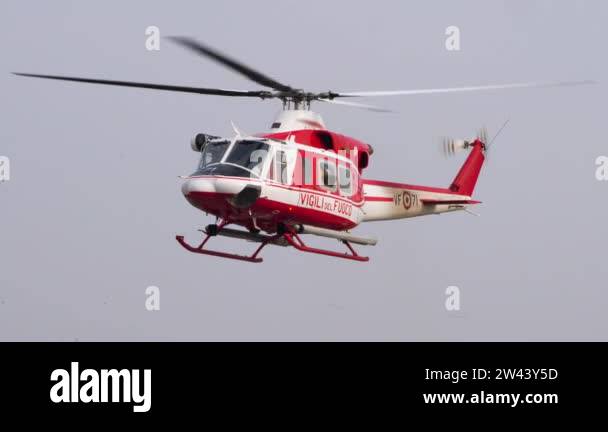 Agusta Bell AB-412 floating in the air. Firefighters search and rescue ...