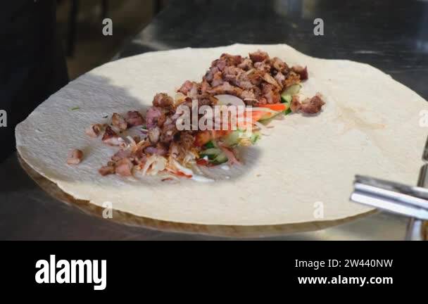 Process of cooking shawarma. Chicken shawarma cooking in restaurant ...