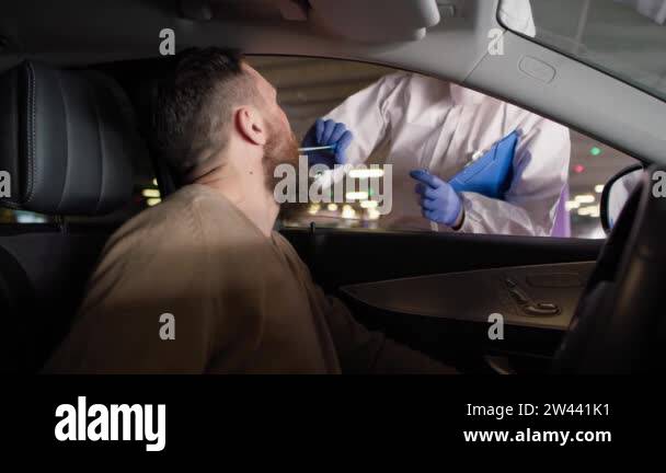 Video of driver during coronavirus drive-thru PCR test procedure. Shot ...