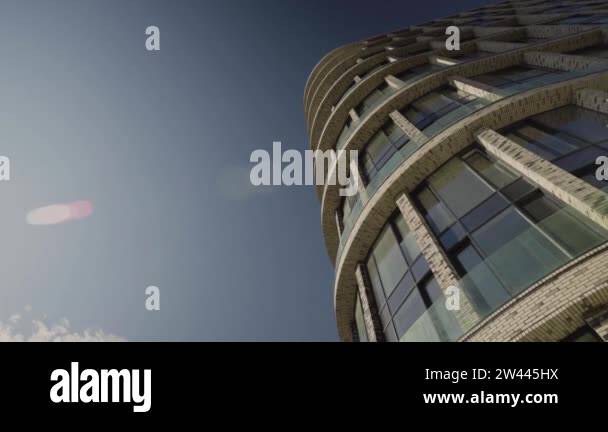 the facade of brick high-rise apartment buildings with stained glass ...