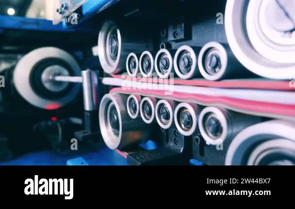 Cable insulation process at a cable manufacturing facility. Automated ...