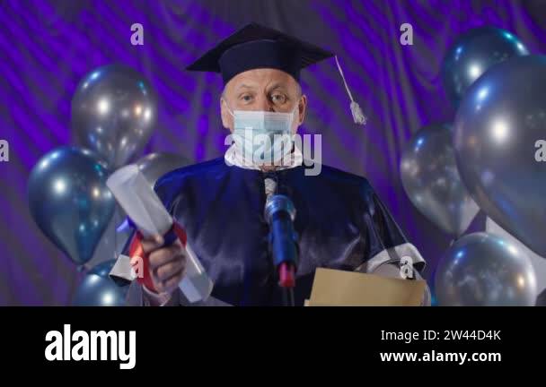 diploma online, male university professor wearing medical mask to ...