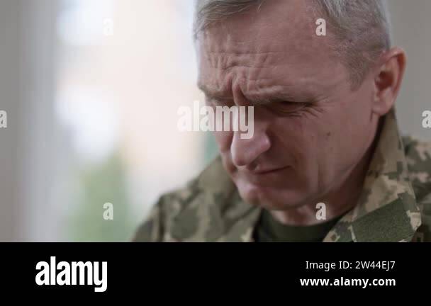 Headshot of middle aged Caucasian military man crying indoors. Close-up ...