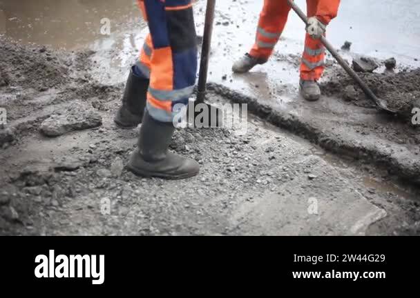 Road repair. Installation of curbs on the highway. The workers are ...