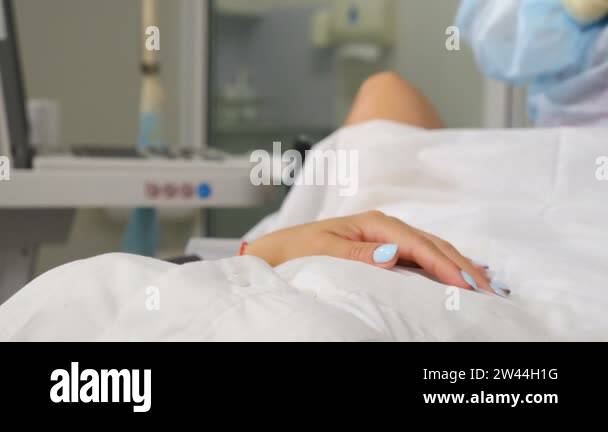 Healthcare and medicine concept. Putting pulse oximeter on female ...