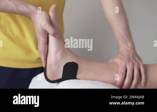 Stretching the Achilles tendon of an athlete after an injury Stock ...