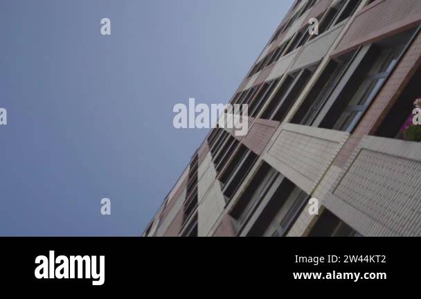 the facade of brick high-rise apartment buildings with stained glass ...