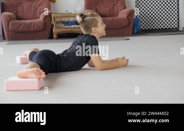 The boy makes a split pose, at this moment he is photographed by a ...
