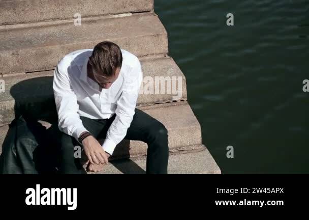 Handsome man sitting down outside Stock Videos & Footage - HD and 4K ...