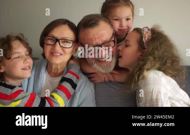 Close indoors portrait of a big happy family. Grandfather and ...
