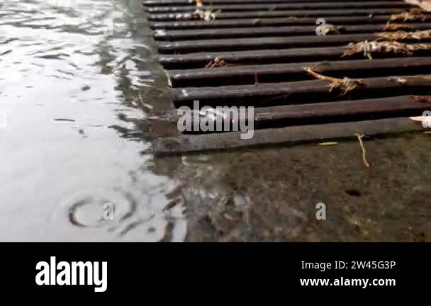 Rain falling on pavementRain water drop falling to the floor. The rain ...