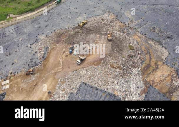 Aerial top view video of a solid waste landfill. City waste treatment ...