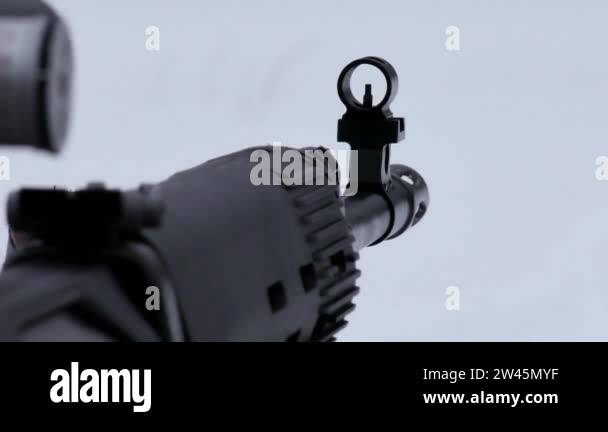 A sniper shoots a Tiger carbine in winter. Shooting at a target through ...