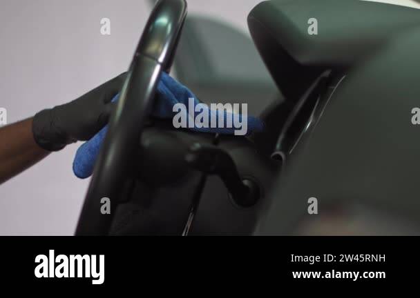 Wipe the steering wheel, the dials and instruments of the car with a ...