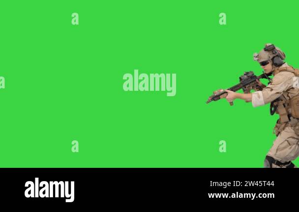 Walking ranger aiming with assault rifle on a Green Screen, Chroma Key ...