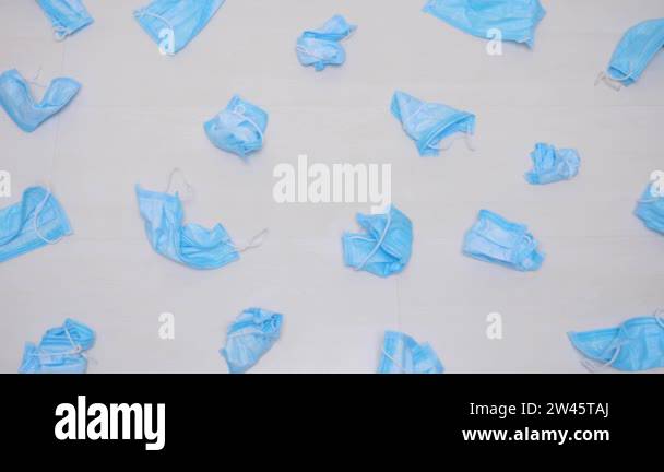 Many used medical masks wiped with a mop.The floor is cleaned by a mop ...