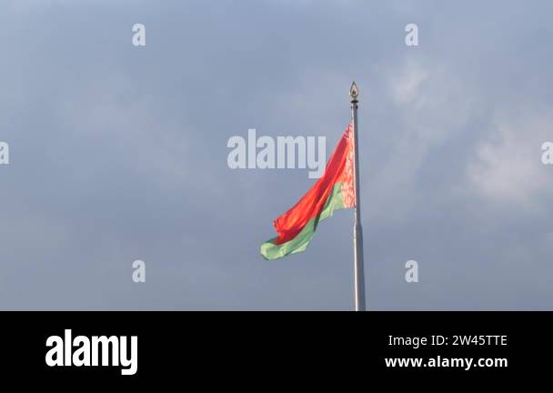 GOMEL, BELARUS - APRIL 19, 2021: Belarusian symbols flag against the ...