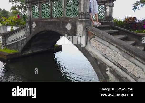 Bridge over the lake in Bali. Architecture in Bali. The traditional architecture of Bali ...