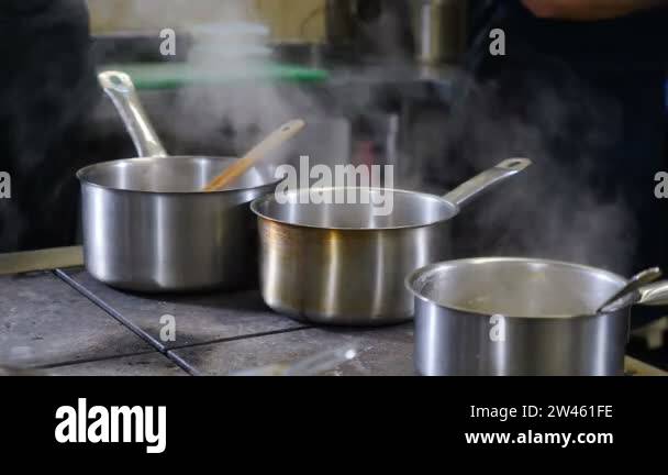 Busy restaurant kitchen concept. Team of chefs and kitchen staff ...