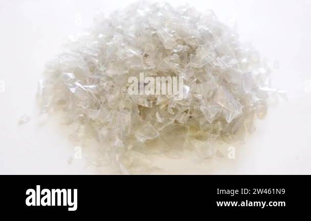 A Pile of PET bottle flakes. Crushed plastic bottle. PET. Plastic ...