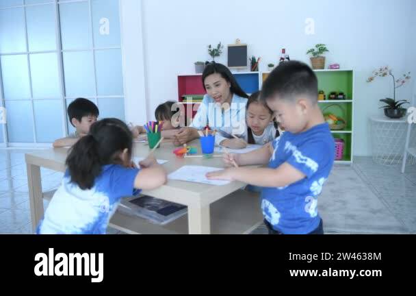 Educational concepts. The teacher is teaching kindergarten children to ... Educational concepts. The teacher is teaching kindergarten children to ...