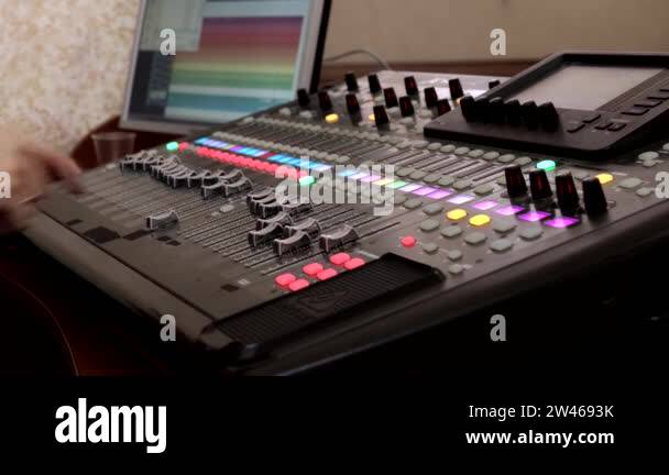 Remote control for adjusting the sound. Audio mixer. Sound engineer adjusts the sound. Music ...