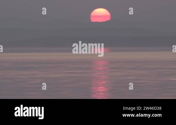 Sun setting over water mountains Stock Videos & Footage - HD and 4K ...