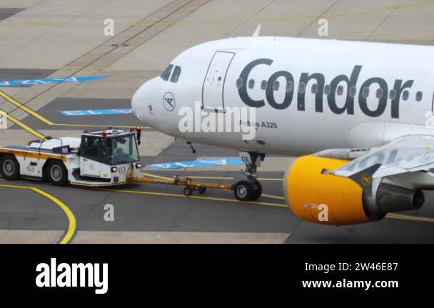 Tow truck pushing a320 airliner on the airport tarmac Stock Video ...