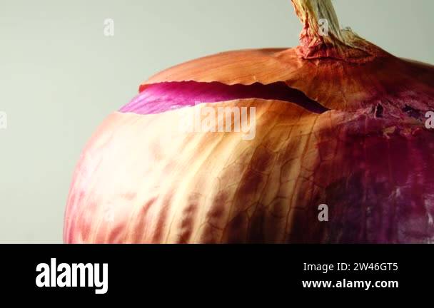 Sliced red onion rings rotating in 4K. Closeup top view of healthy food ...