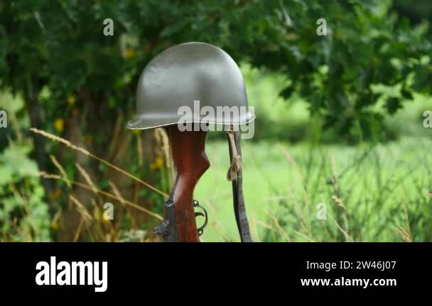 Memorial battlefield cross. Symbol of a fallen US soldier. M1 rifle ...