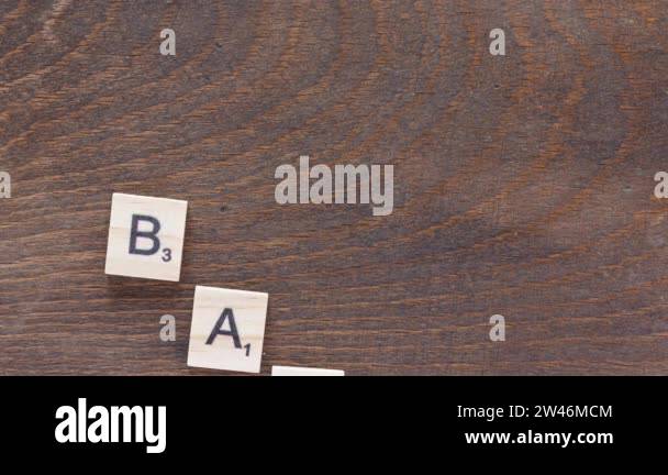 stop motion animation with lettering back to school with light wooden ...