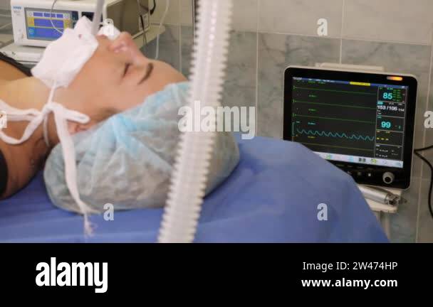 close-up. female patient, in a state of anesthesia, lies on the ...