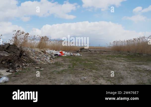 garbage dump near the river. Ecological Problem. Illegal construction ...
