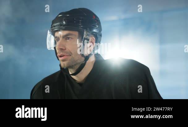 Close up of handsome young Caucasian male hockey player in helmet ...