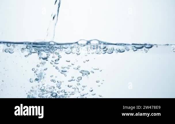 Freshness of clear blue liquid on white background. Brilliant stream of ...