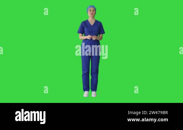 Female doctor in blue uniform talking about medical care on a Green ...