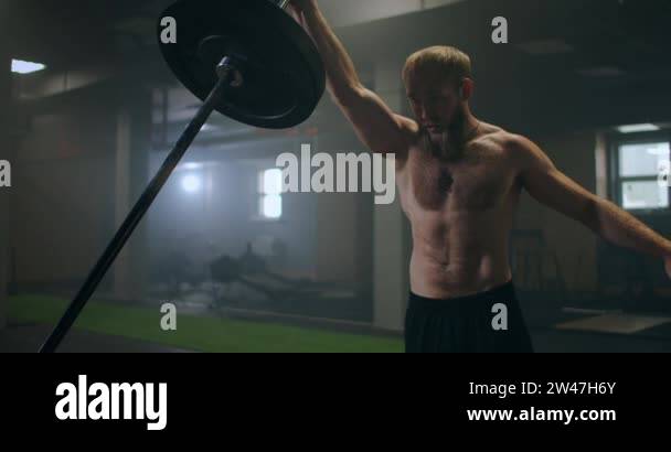 training of the boxer striking technique. Push the bar with one hand. build-up of force blows ...